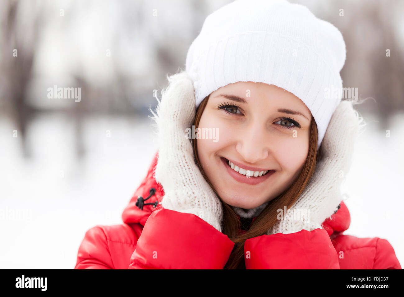 The beautiful smiling woman on walk in winter wood Stock Photo - Alamy
