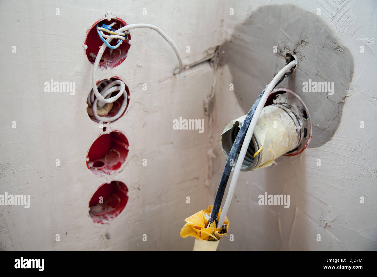 new wiring in the wall of the room detail closeup Stock Photo - Alamy
