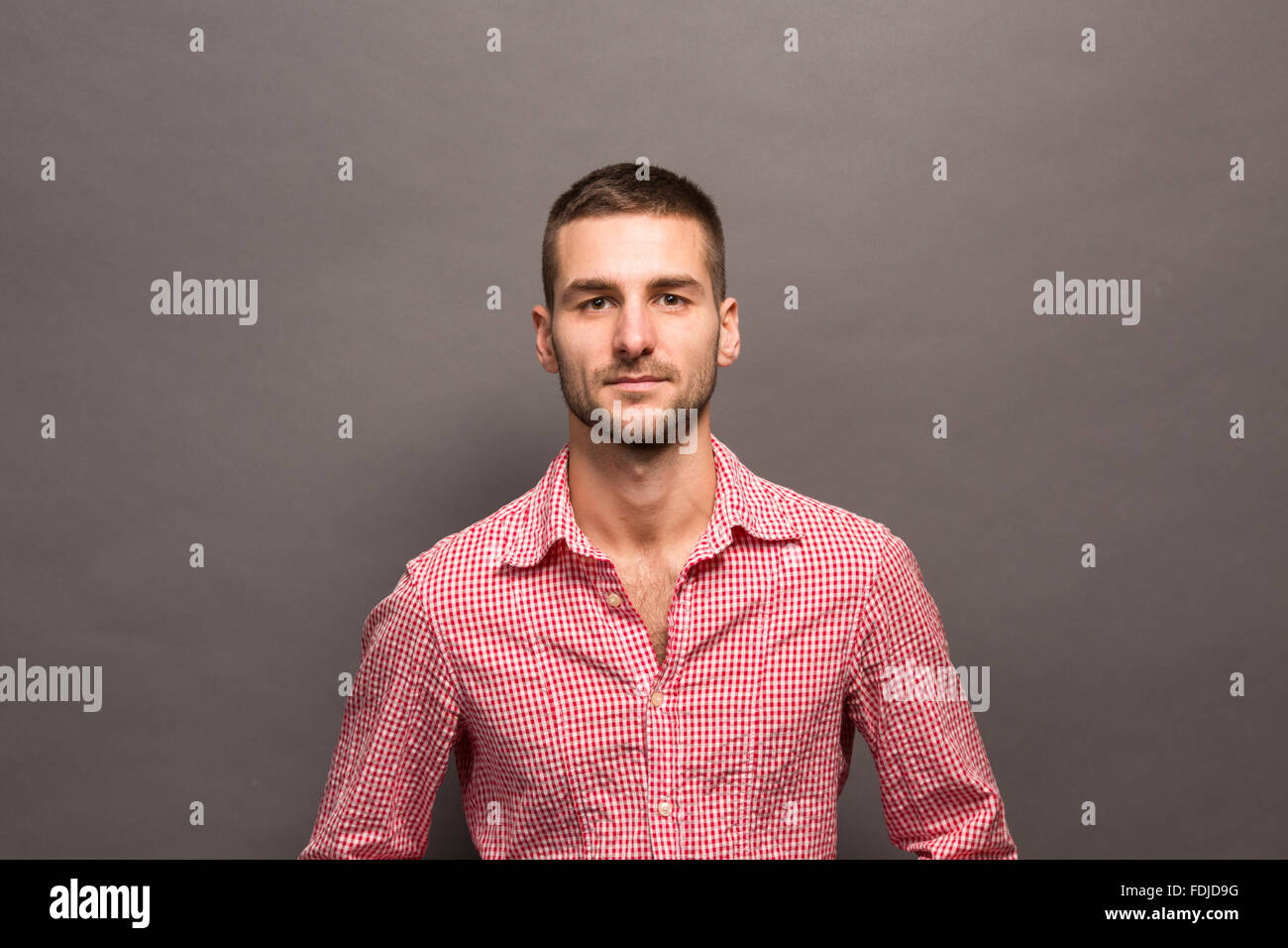 Handsome man in studio Stock Photo - Alamy