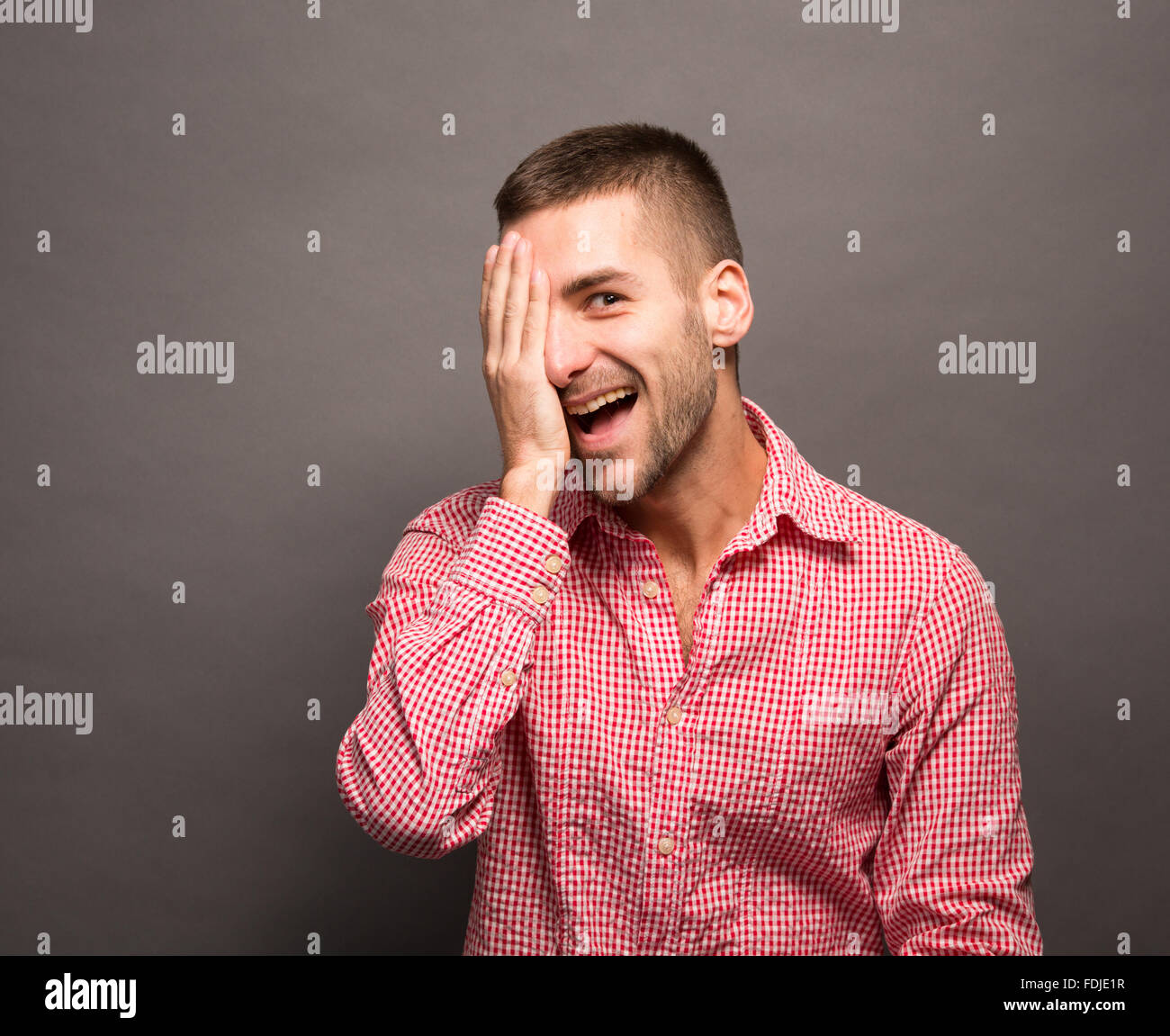 Man covering eyes his face Stock Photo - Alamy