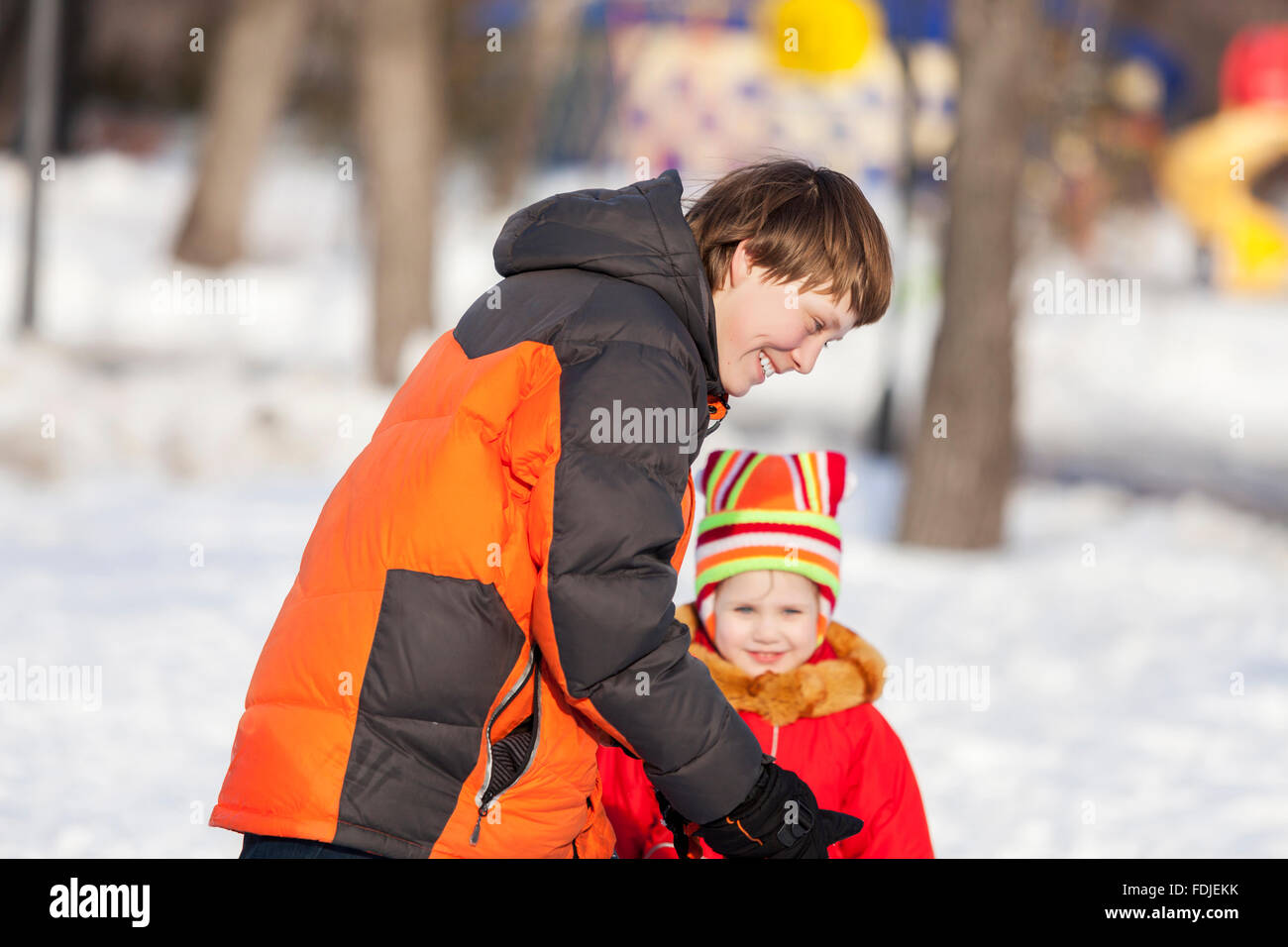 Kid playing snowball fight hi-res stock photography and images - Alamy