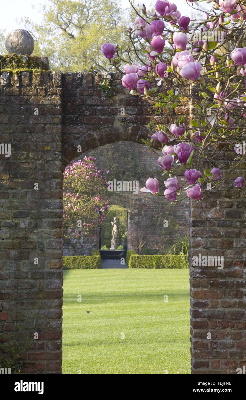 View through an arched brickwork gate in the White Garden at ...