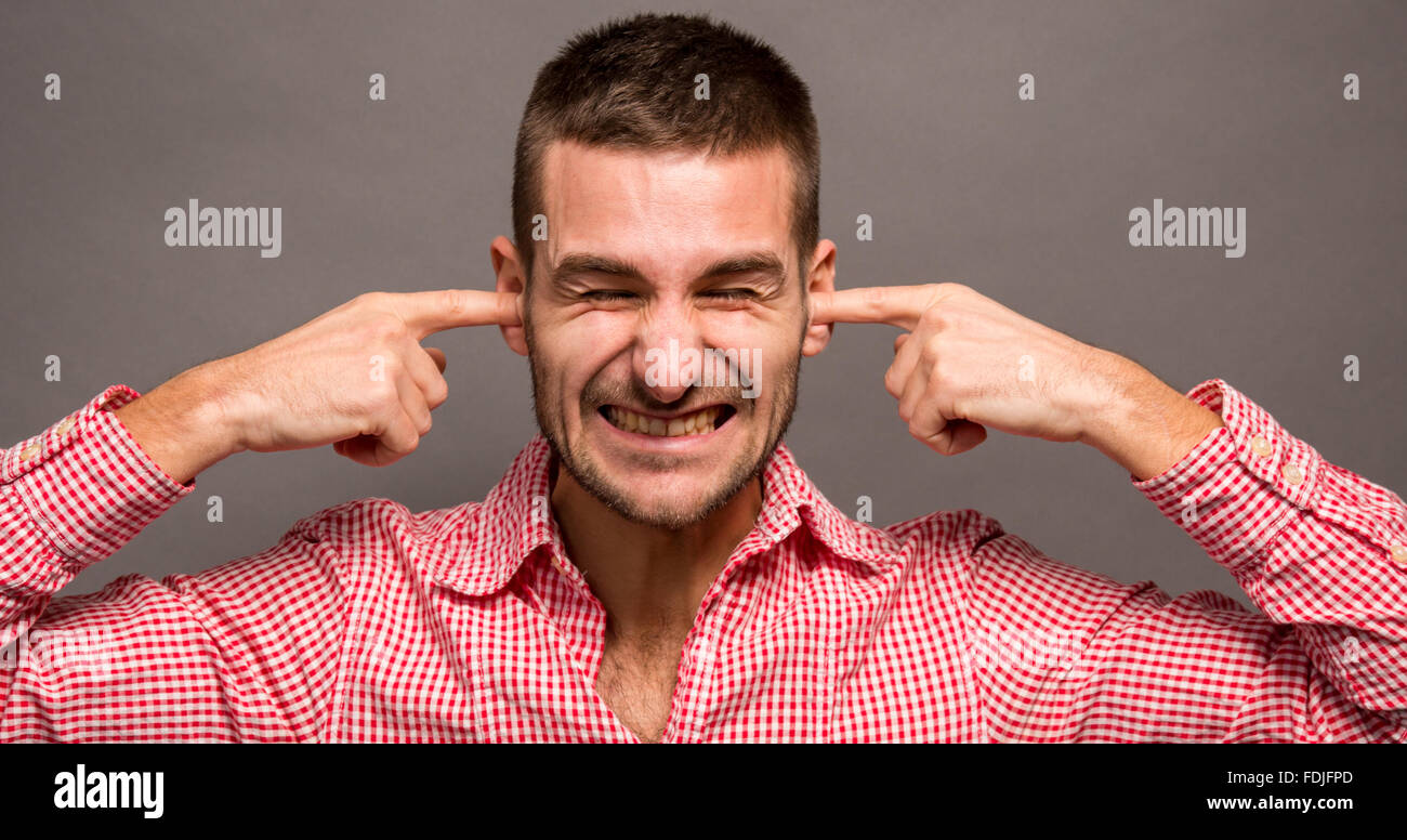 Covering ears pain hi-res stock photography and images - Alamy