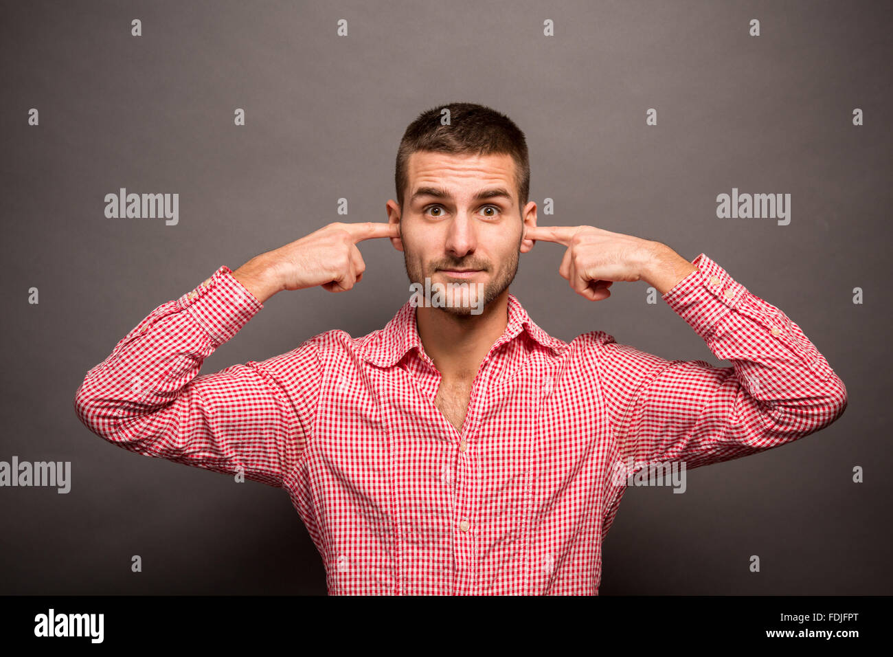 Hands covering ears hi-res stock photography and images - Alamy