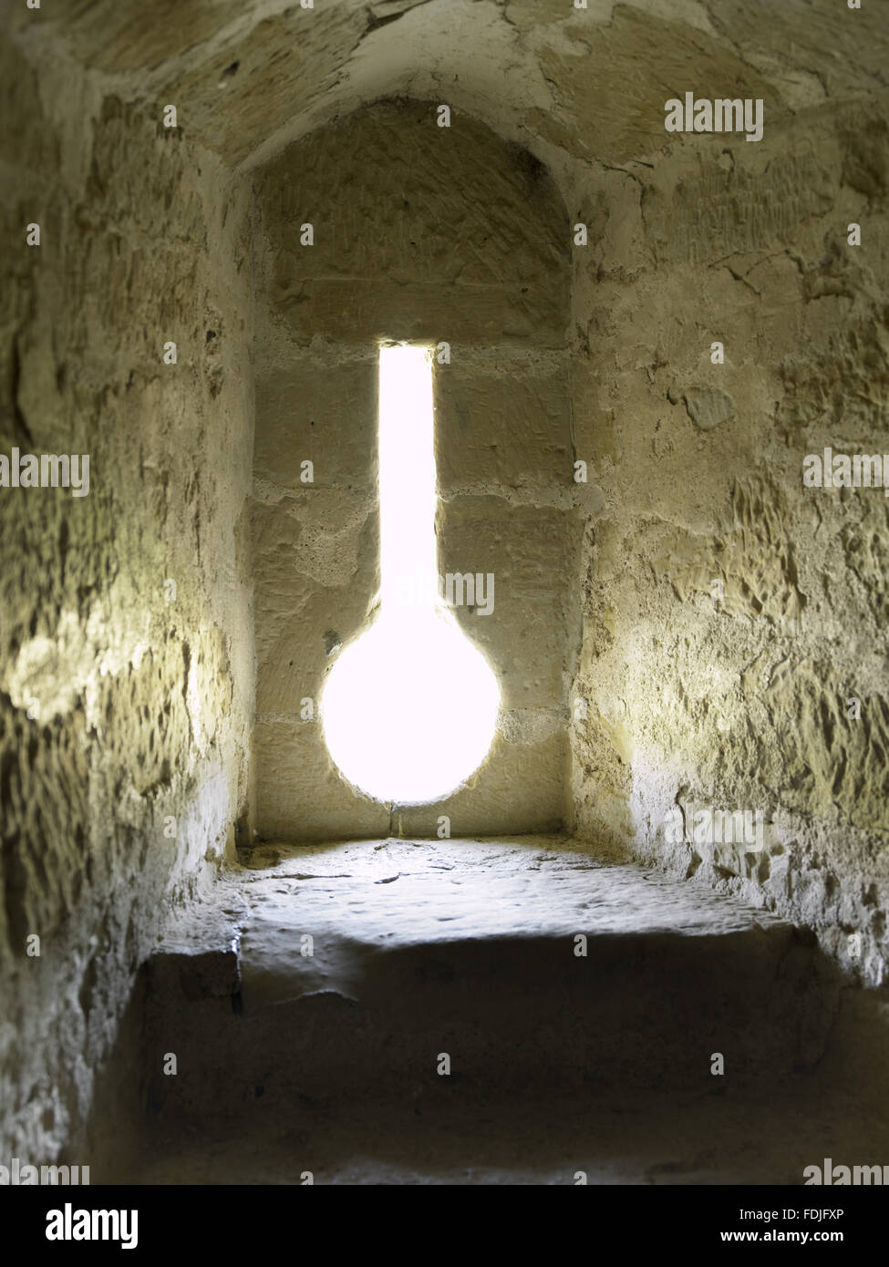 A gun-loop seen from inside the Gatehouse at Bodiam Castle, East Sussex ...