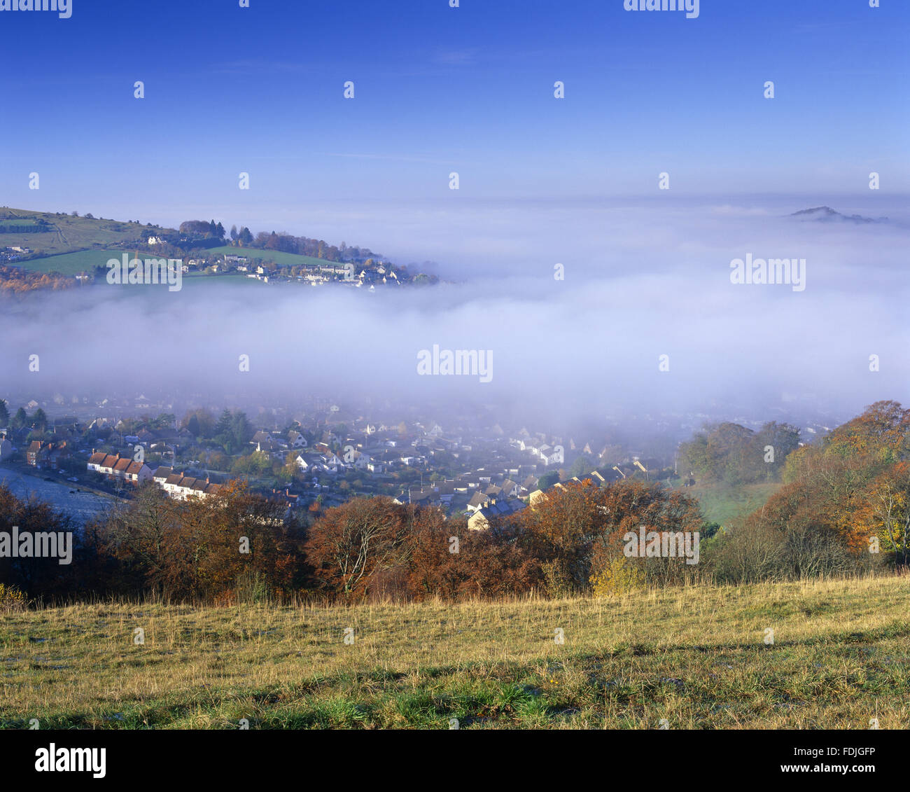 Mist rising off the houses of Selsley in the valley from Rodborough ...