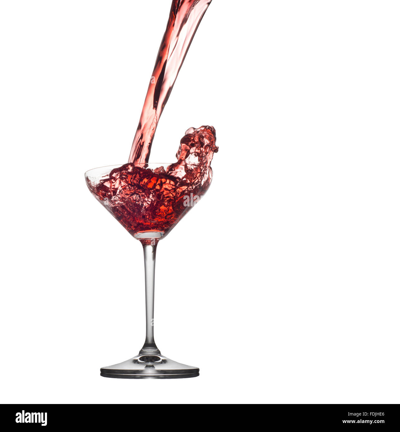 Red cocktail splashing from glass isolated on white background Stock ...