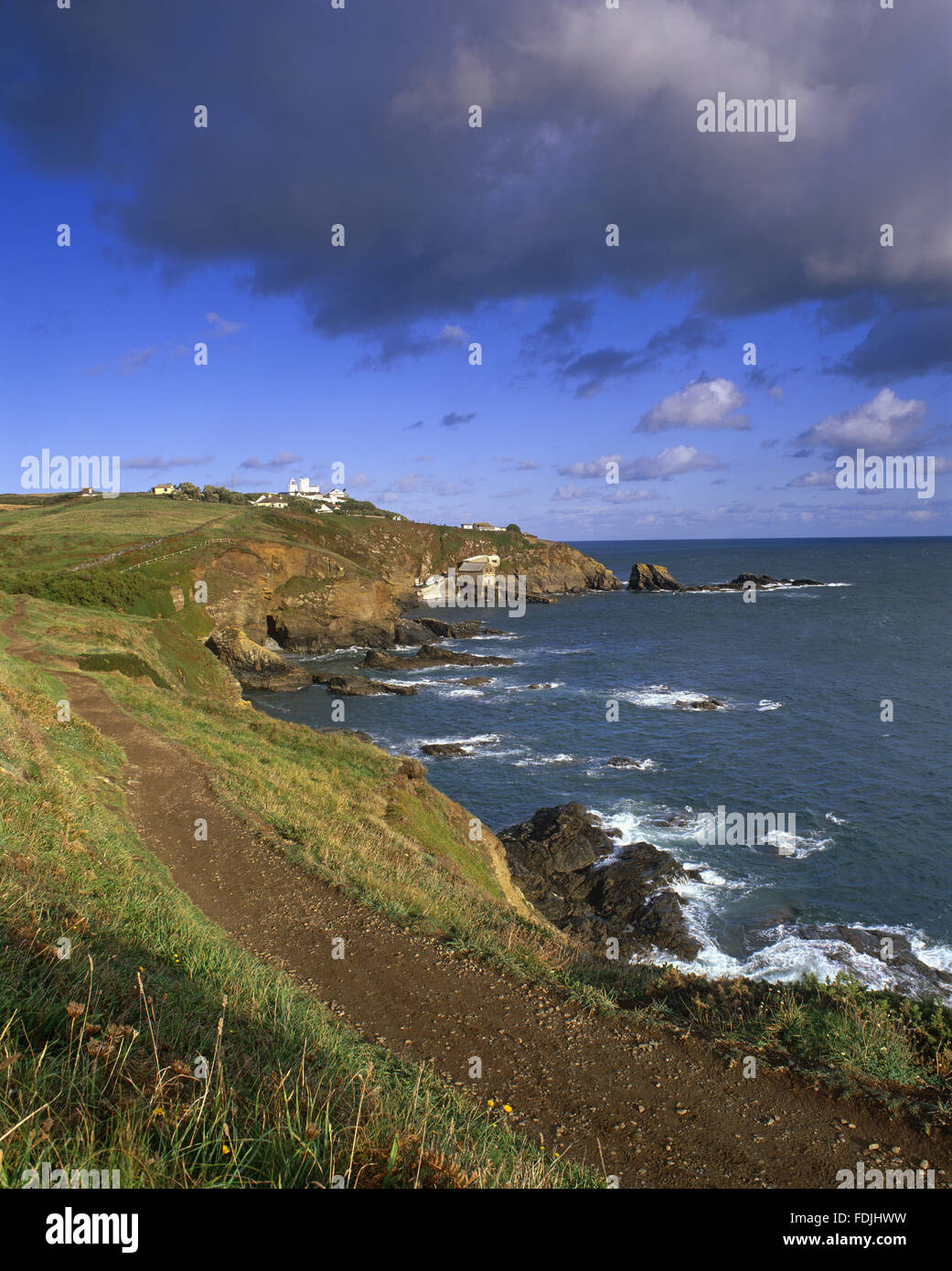 A view along the peninsula towards Lizard Lighthouse, at Lizard Point ...