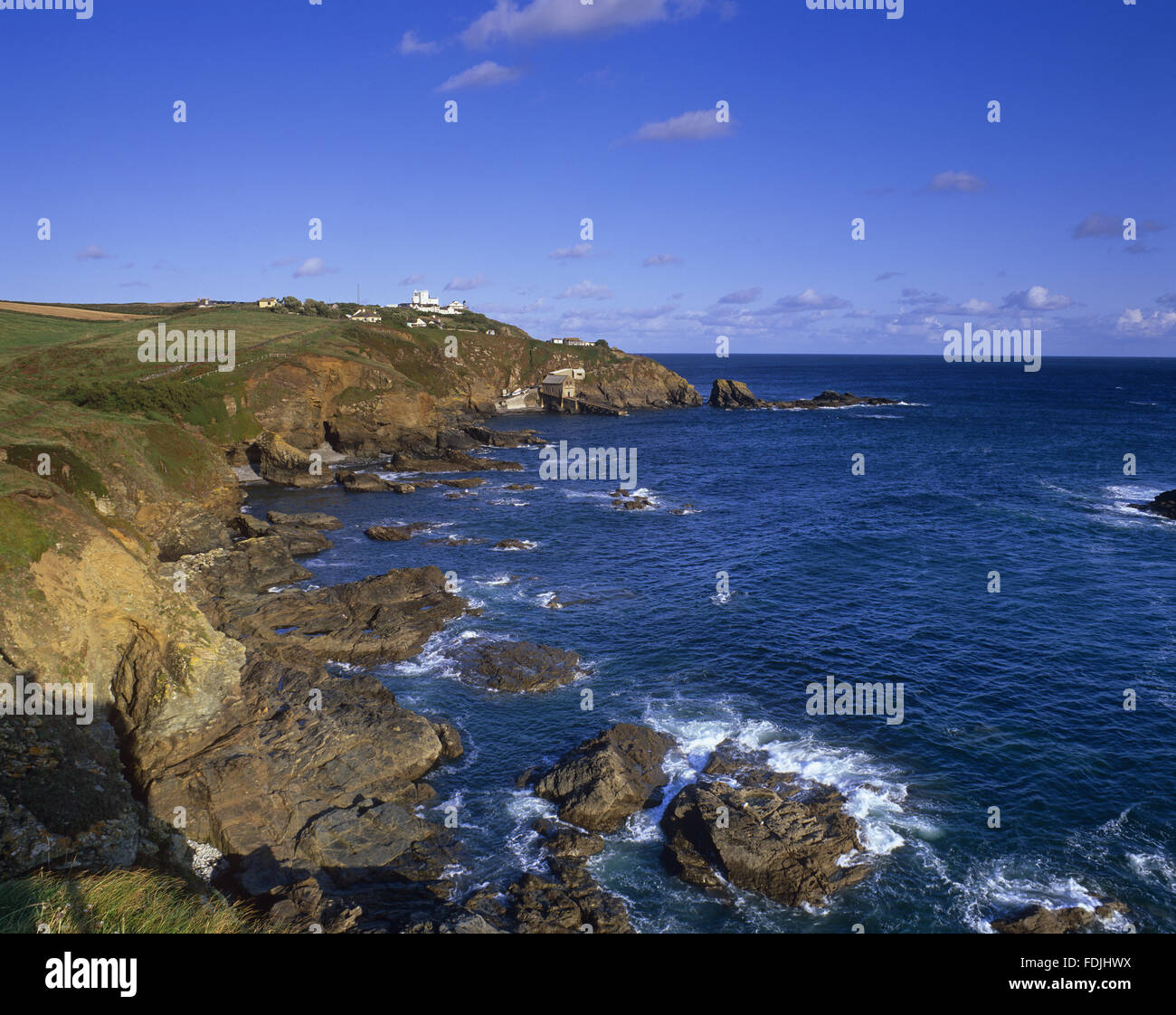 A view along the peninsula towards Lizard Lighthouse, at Lizard Point ...