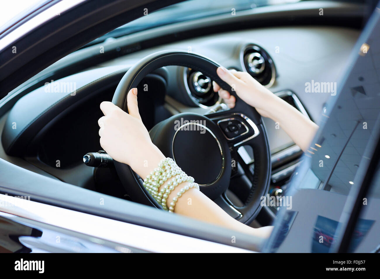 Close up of woman hands driving a car Stock Photo - Alamy