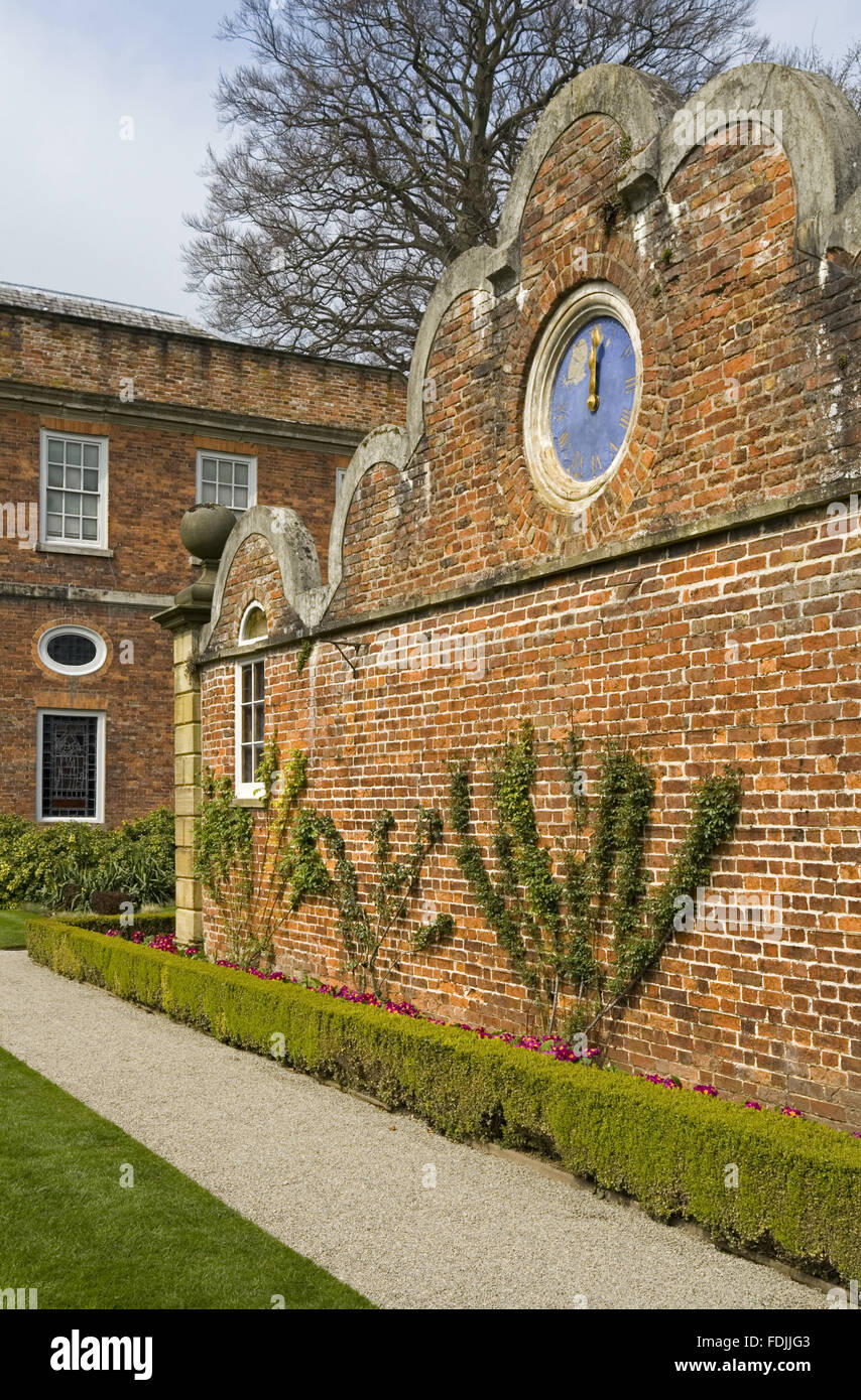 The cusped gable wall and clock brought from Stansty Park, at Erddig ...