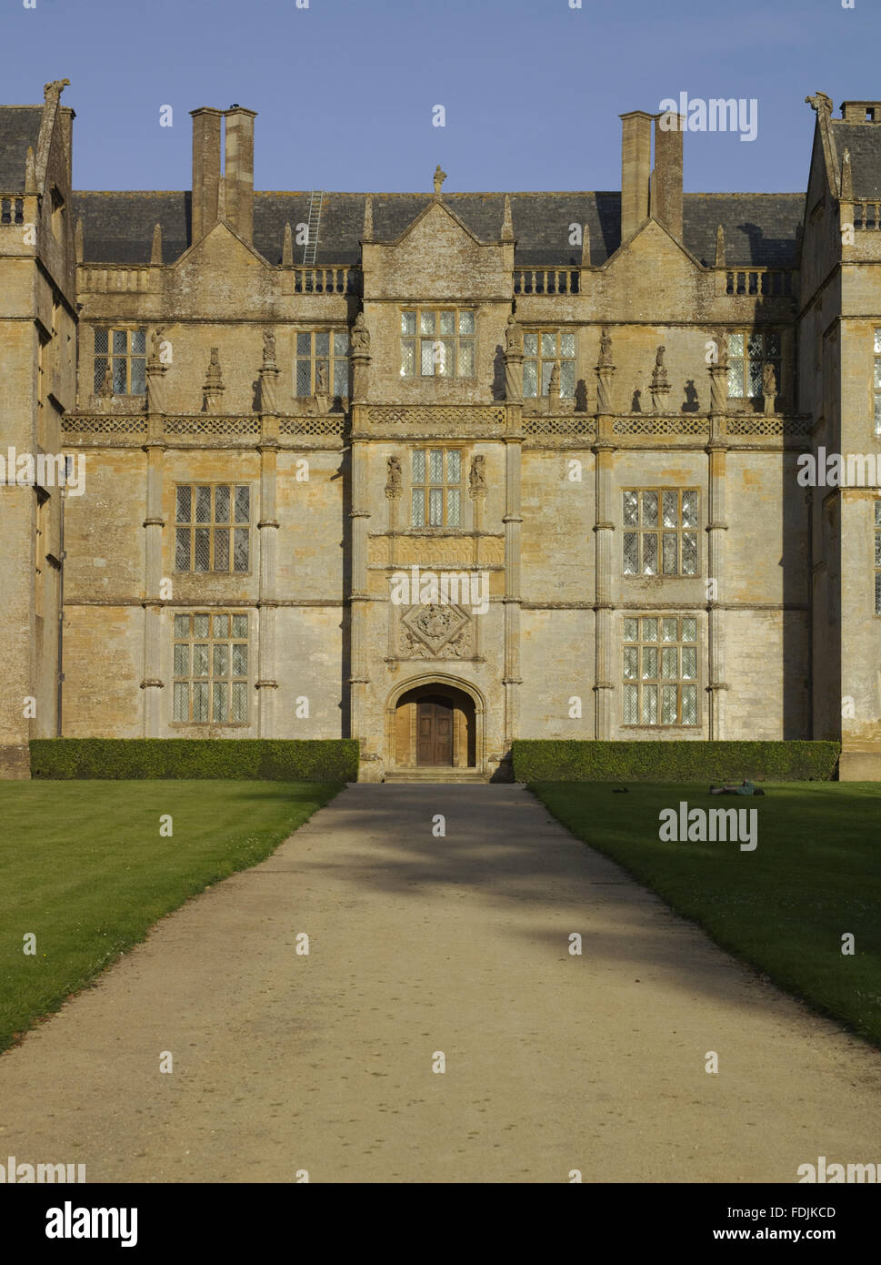 The drive towards the west front with projecting bay and porch at ...