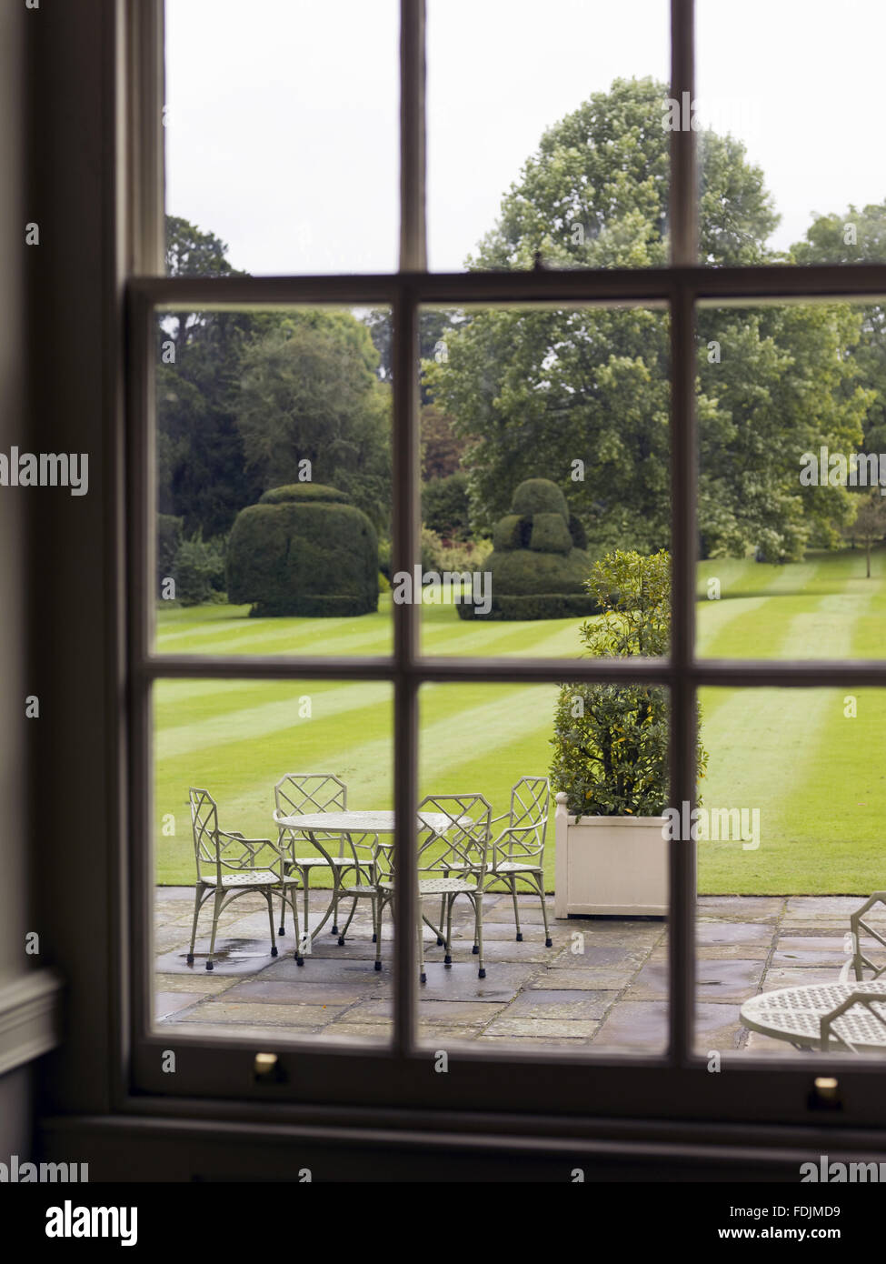 A view from a window out to the terrace at Hartwell House, a historic ...