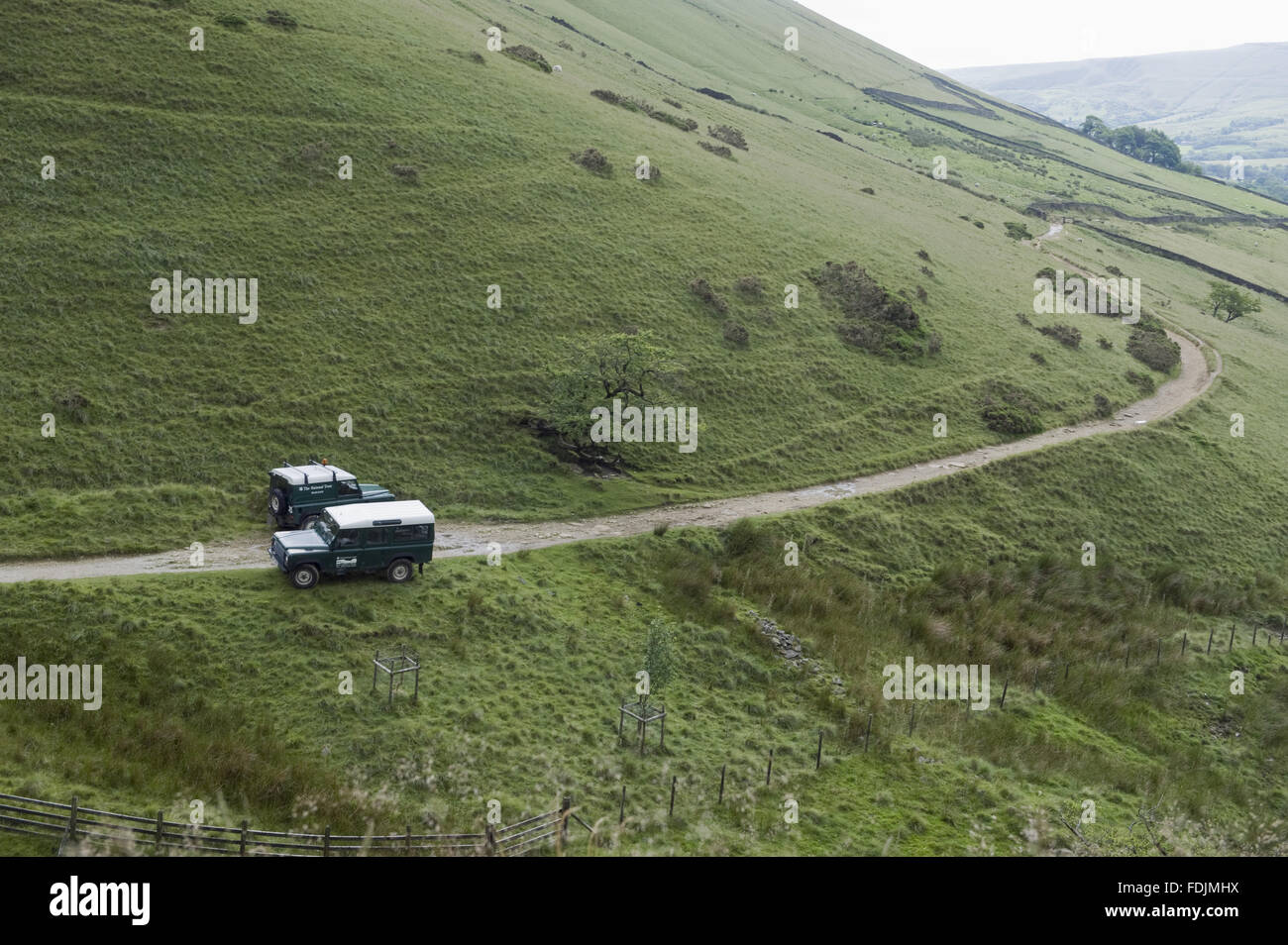 Wardens' Landrovers on a hillside track at Edale, part of the High Peak ...