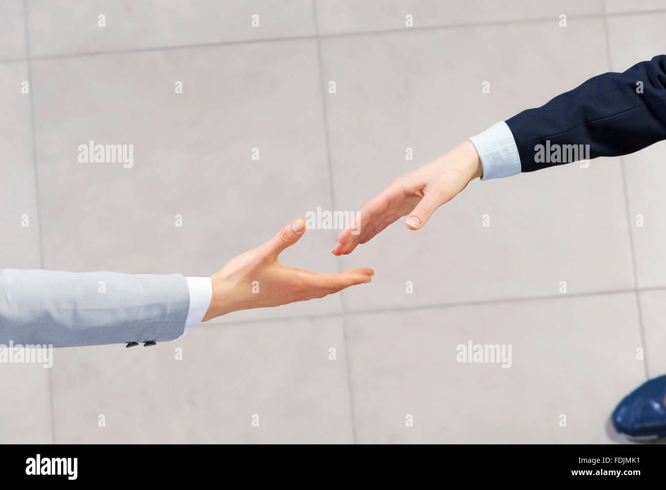 Close up of business handshake between two colleagues Stock Photo - Alamy