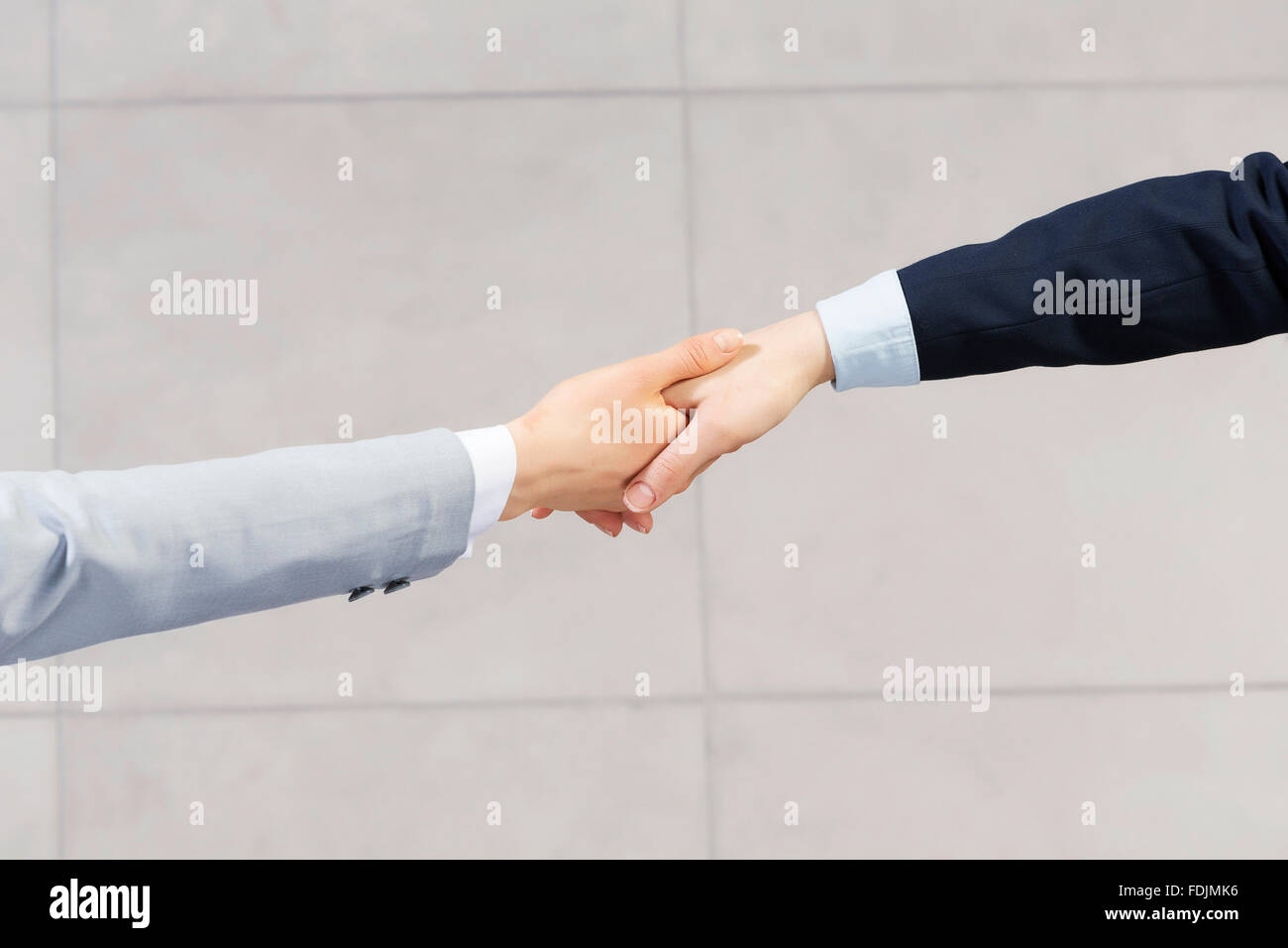 Close up of business handshake between two colleagues Stock Photo - Alamy
