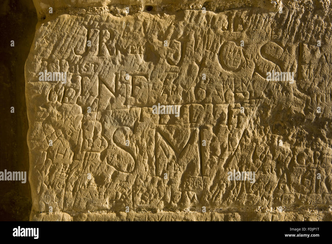 Close view of ancient graffiti carved into the stonework at Bodiam ...