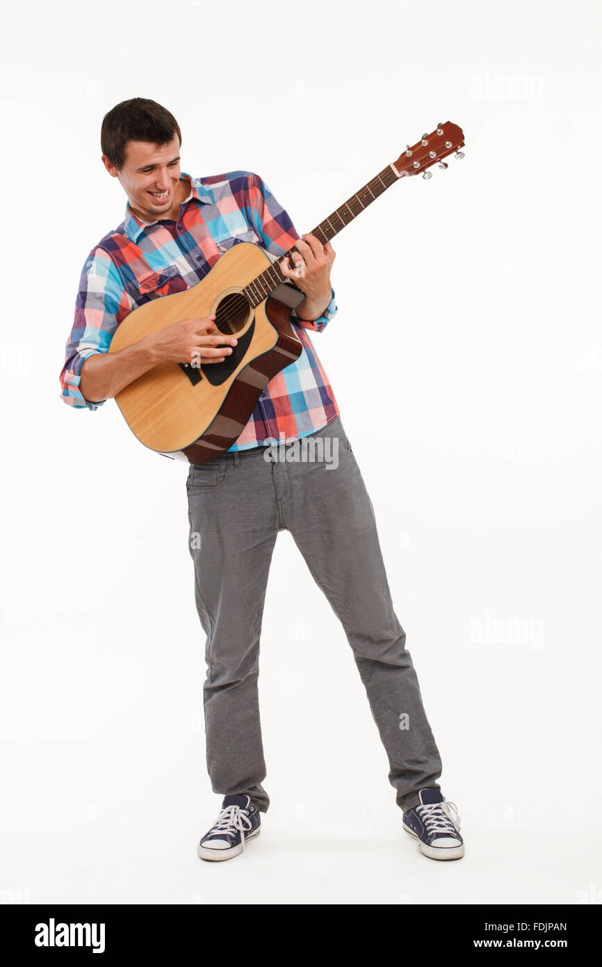 Joyful guy playing guitar Stock Photo - Alamy