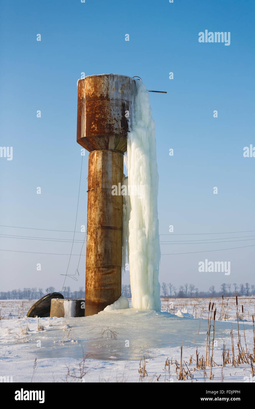 Frozen water from broken water tower in winter Stock Photo - Alamy