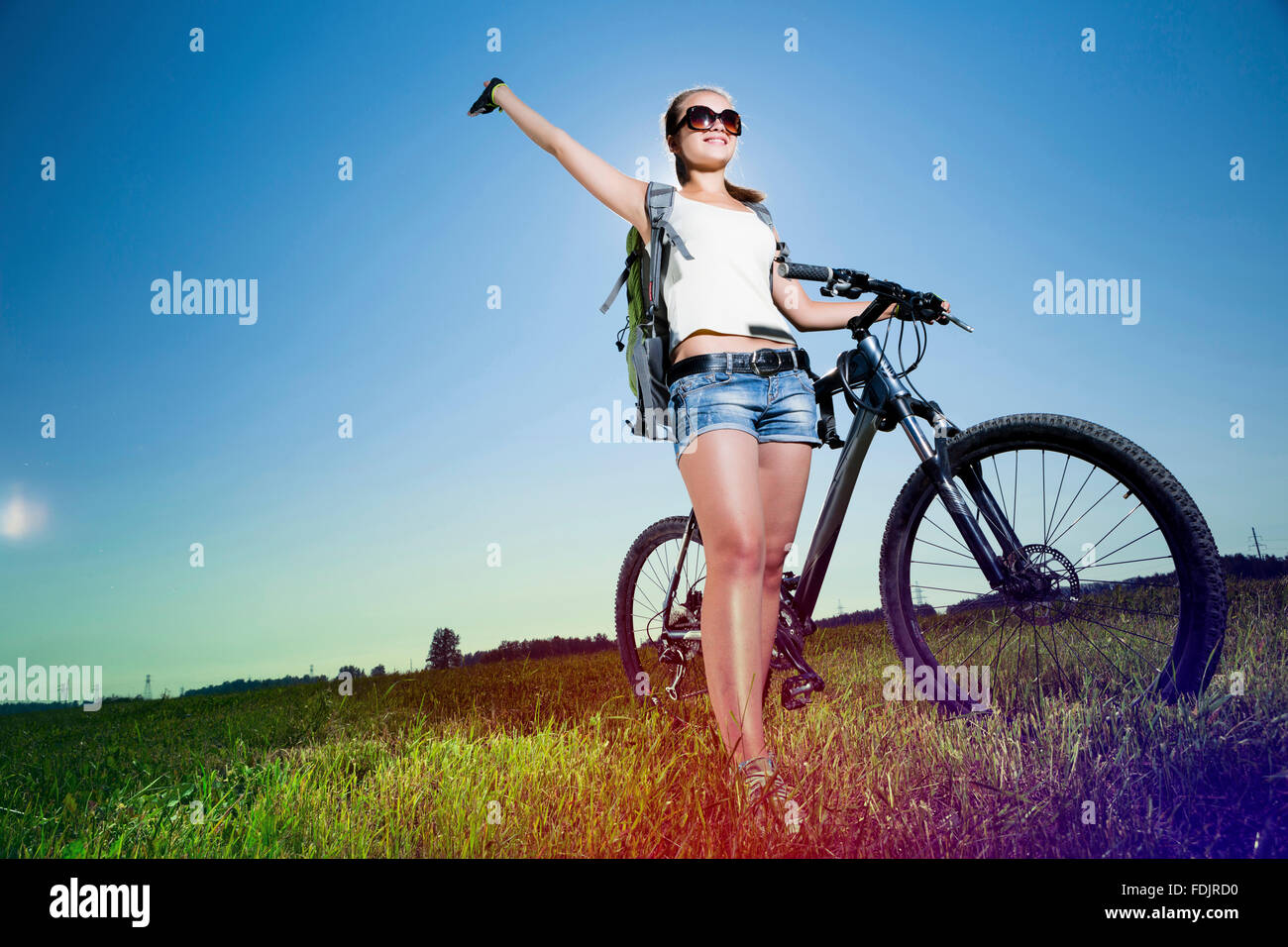 Girl riding bicycle low angle hi-res stock photography and images - Alamy