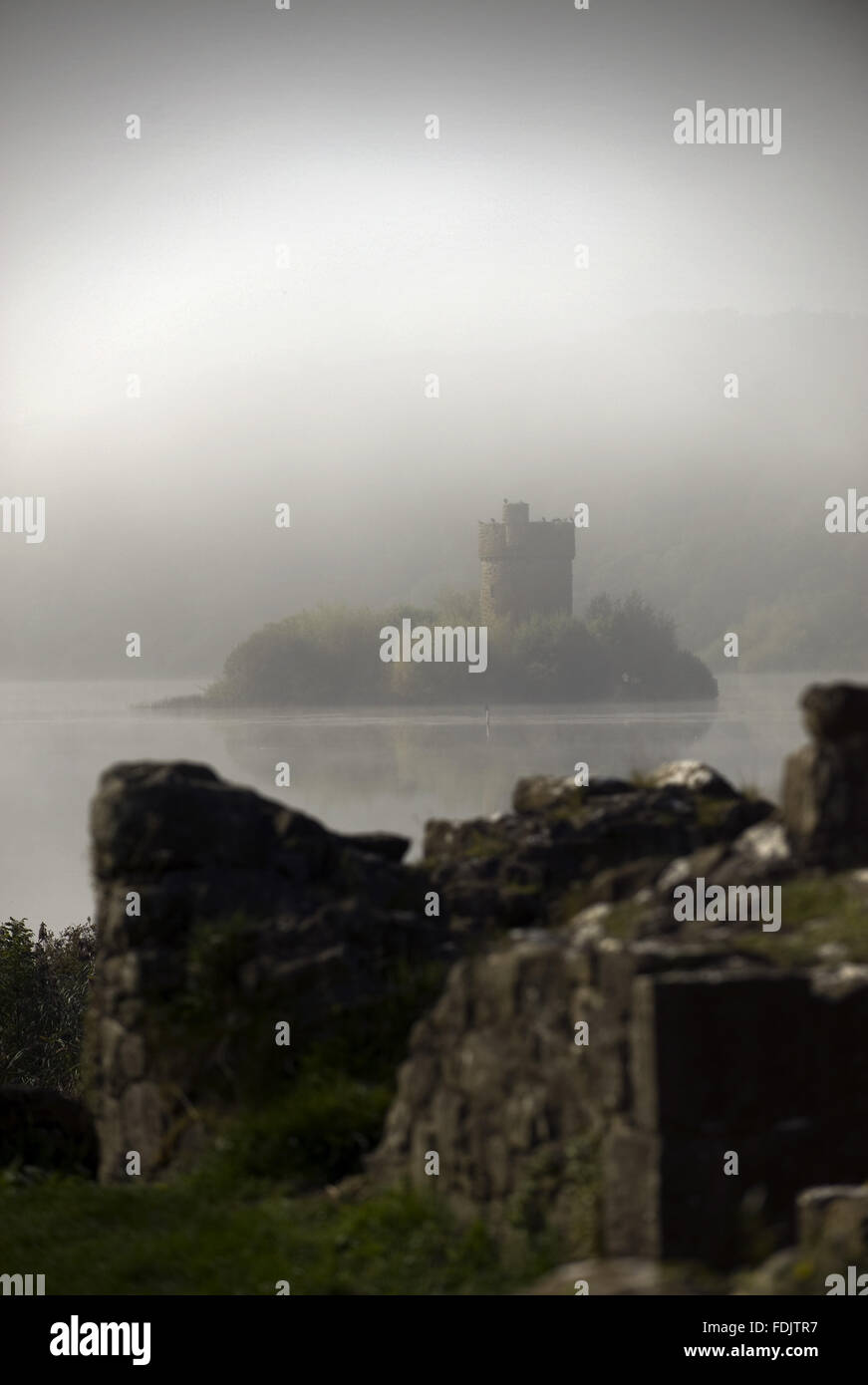 A misty view towards Crichton Tower on Gad Island in Lough Erne at Crom ...