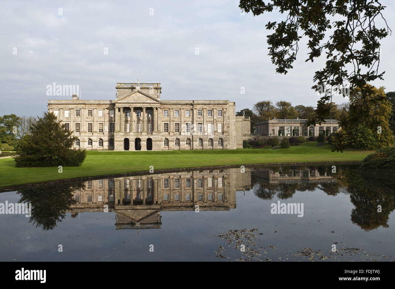 The south front of Lyme Park, Cheshire, seen across the lake, in autumn ...