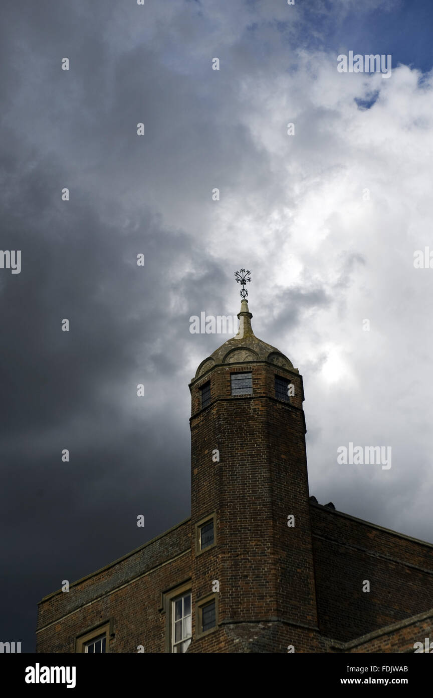 One of the ogee-roofed turrets at Melford Hall, Suffolk, against a ...