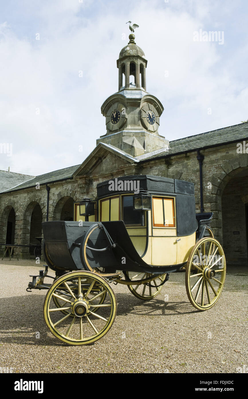 The early 1800s Travelling Chariot, with the stable block beyond, part ...