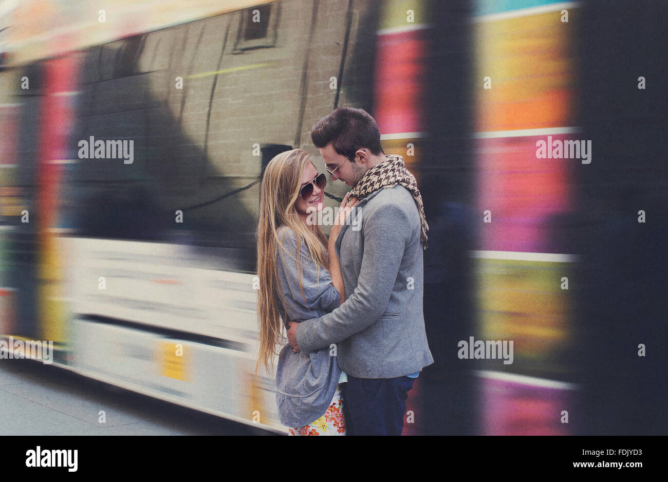 Couple hugging at train station hi-res stock photography and images - Alamy
