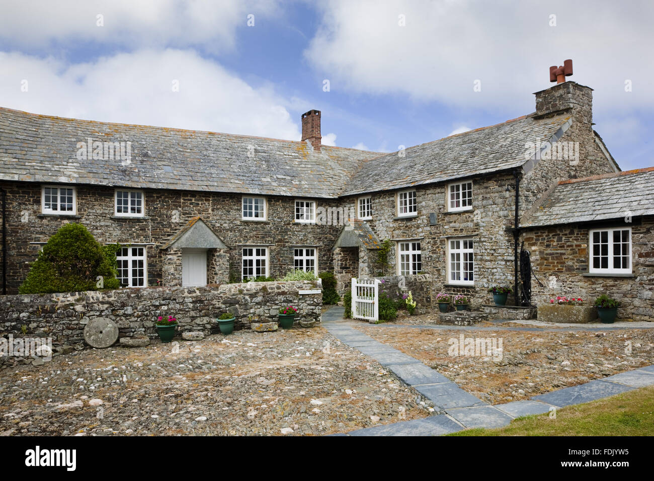 Trevigue Farm, a sixteenth-century farmhouse around a cobbled courtyard ...