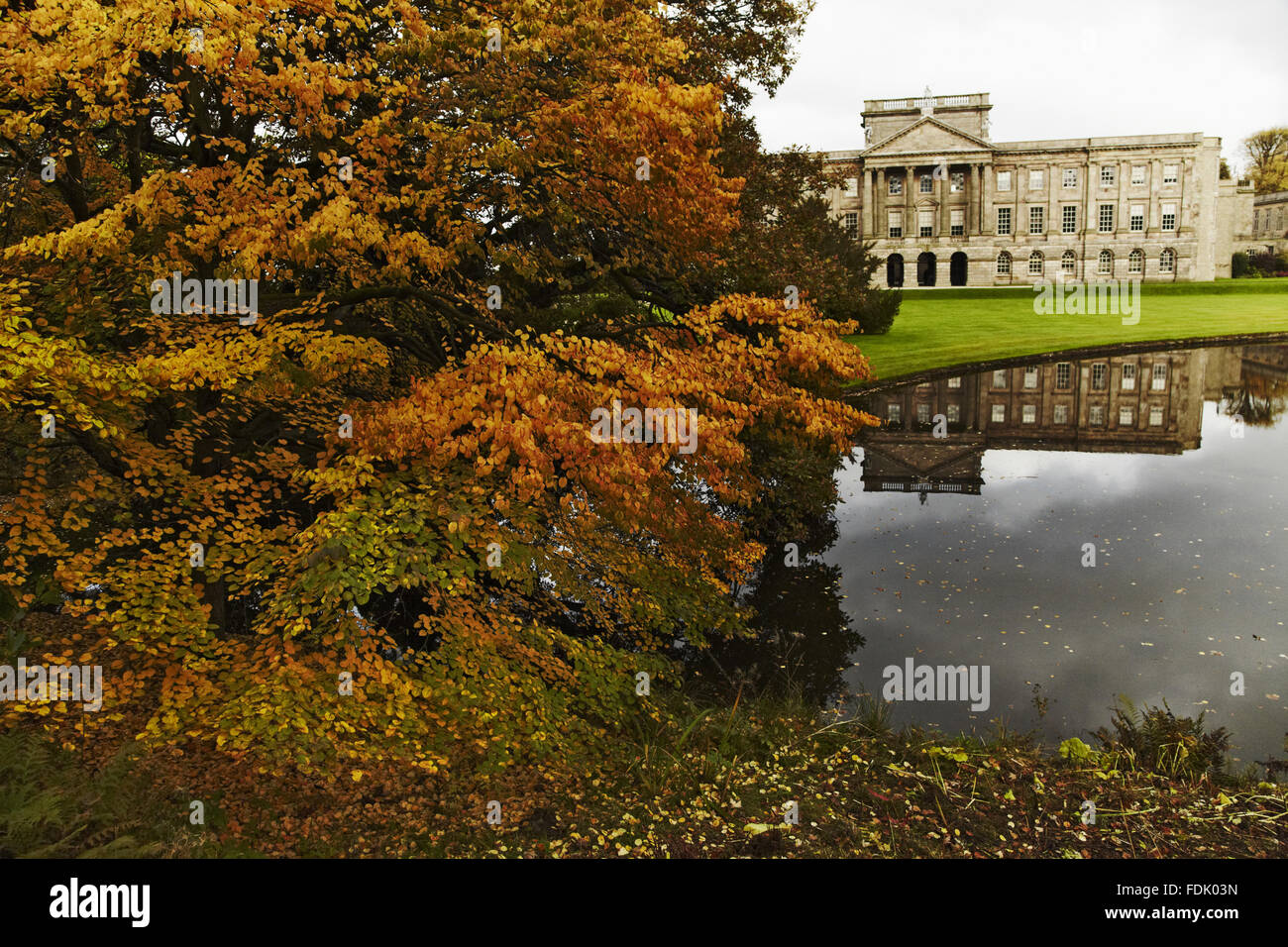 The lake and south front of Lyme Park, Cheshire in autumn. The house ...