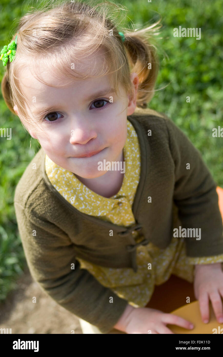 Child girl smiling at the camera Stock Photo - Alamy