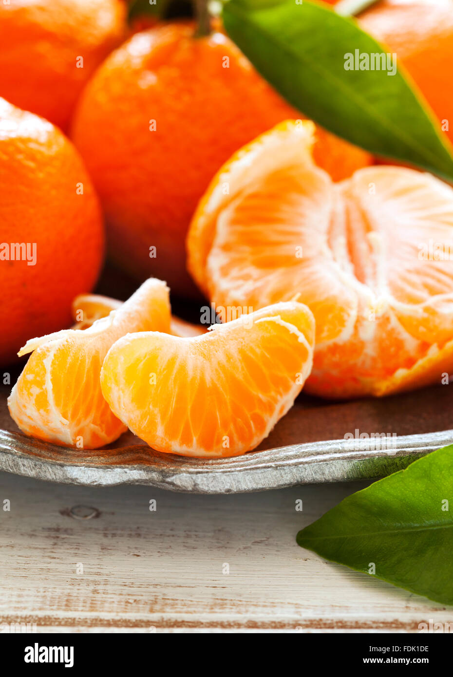 Tangerines on a plate Stock Photo - Alamy