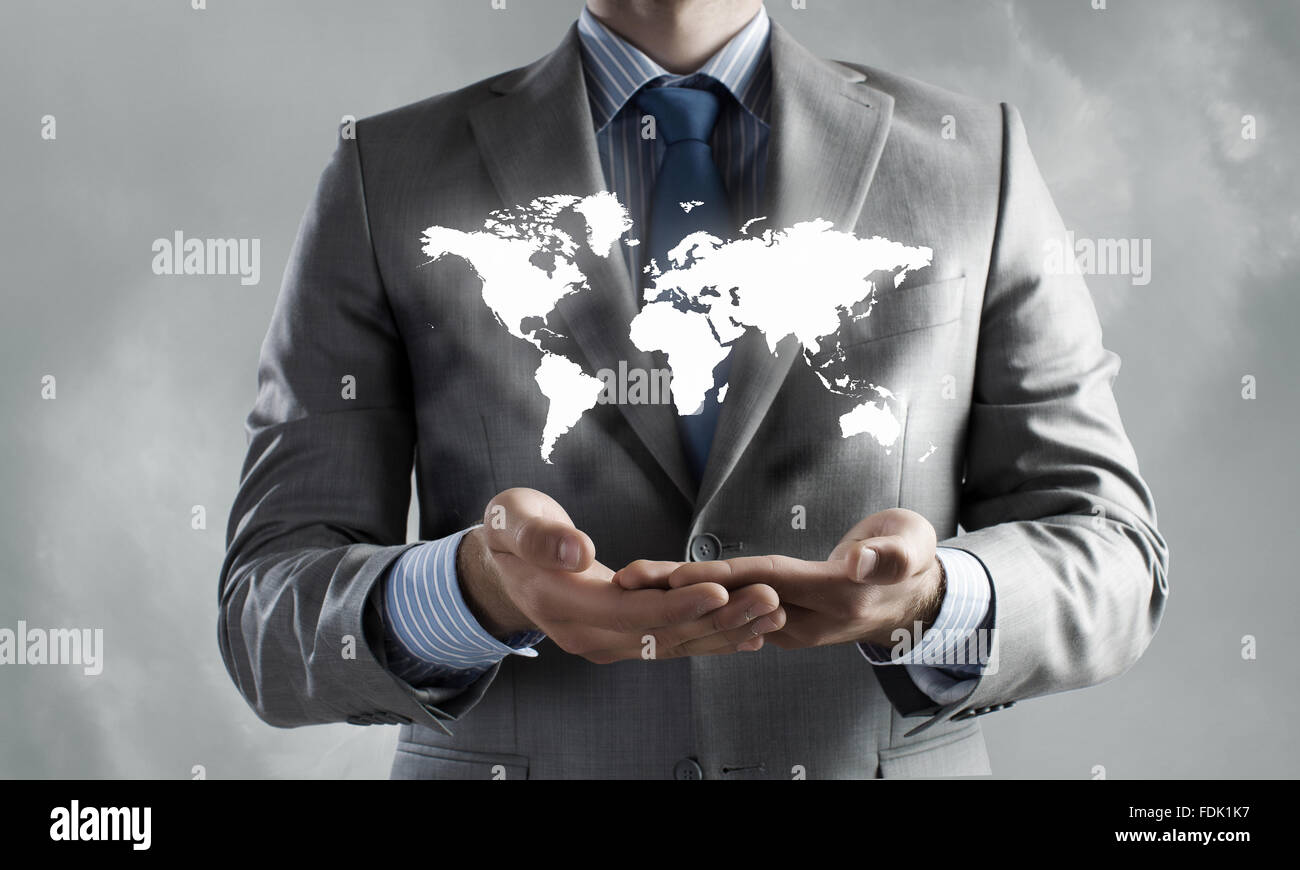 Close up of businessman holding world map in hands Stock Photo - Alamy