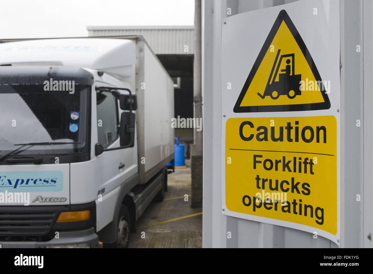 Lorry, and Caution sign at the Melksham Distribution Centre, Wiltshire ...
