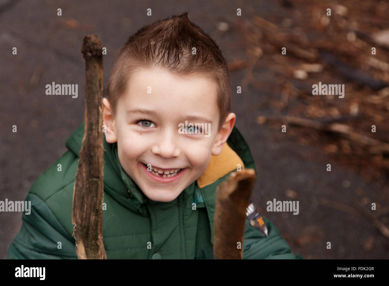 Boys holding sticks hi-res stock photography and images - Alamy