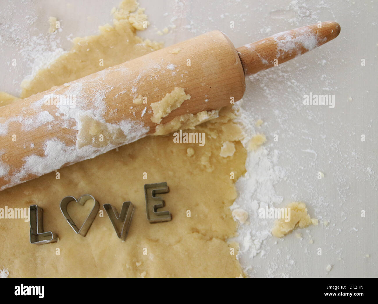 Rolling pin and pastry cutters spelling word love hi-res stock ...