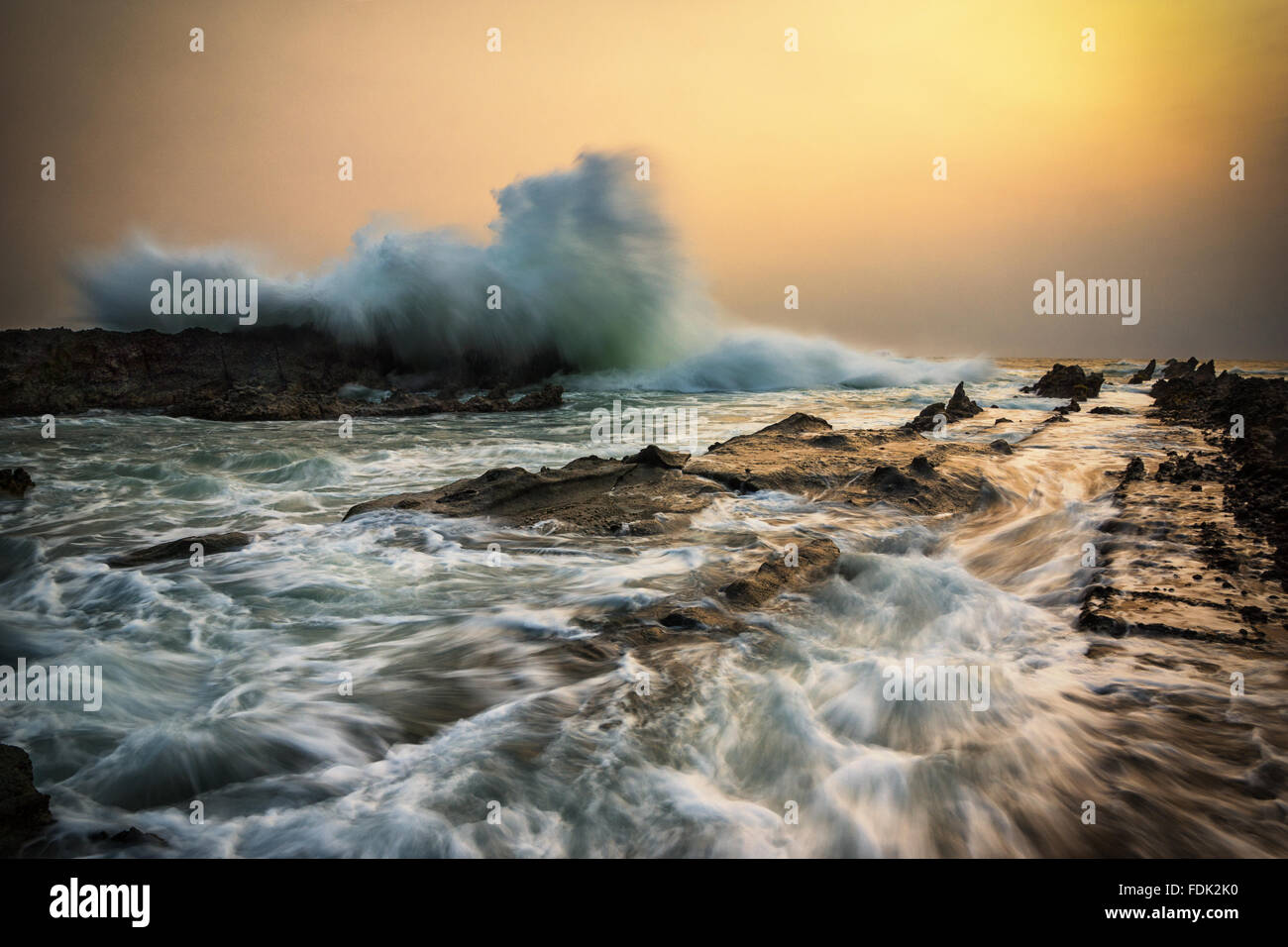 Wave crashing against rocks, Sawarna, Indonesia Stock Photo - Alamy