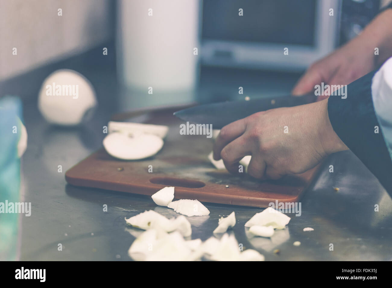 Chef chopping an apple Stock Photo - Alamy