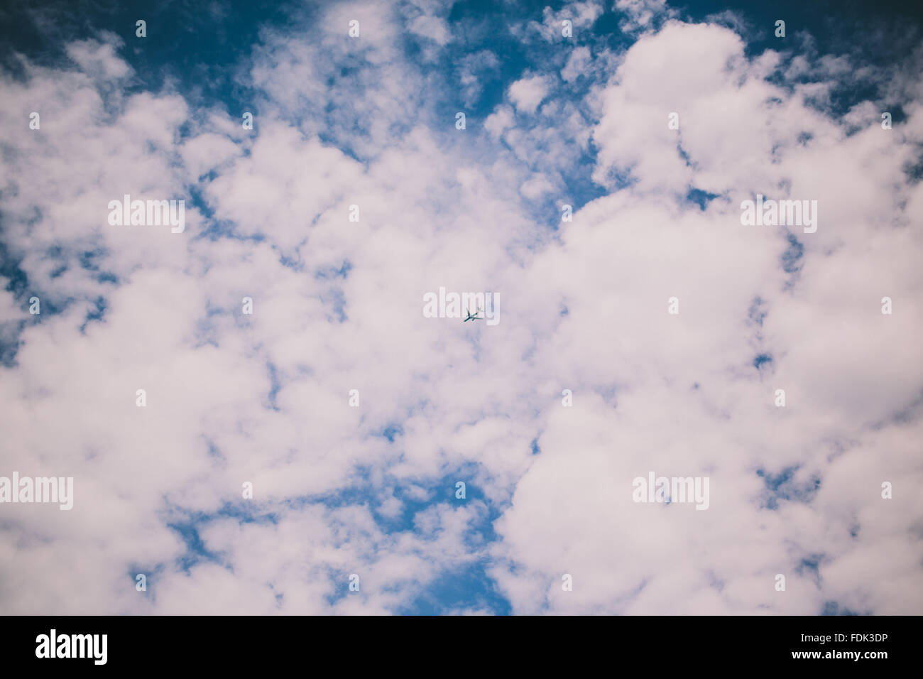 Airplane flying through cloud Stock Photo - Alamy