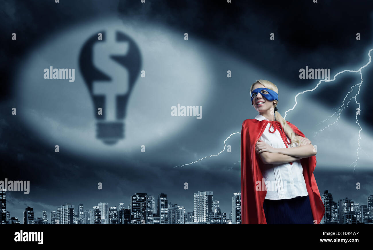 Young woman super hero and dollar sign in spotlight Stock Photo - Alamy