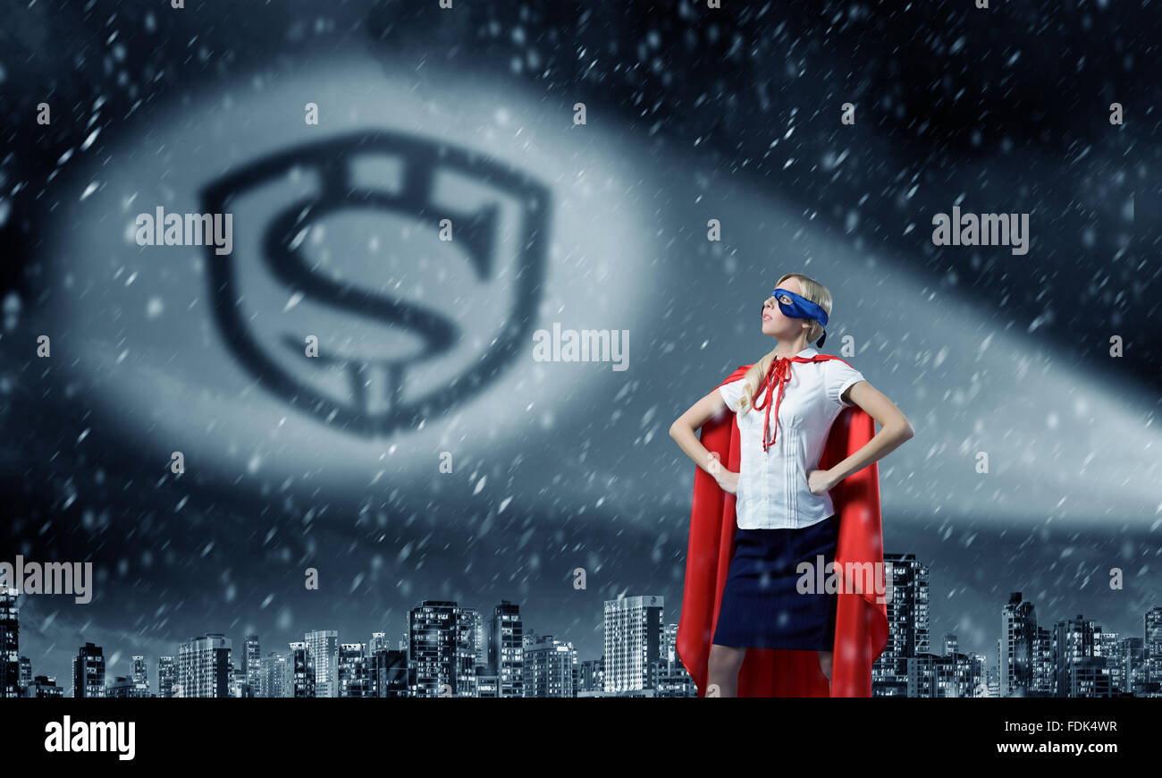 Young woman super hero and dollar sign in spotlight Stock Photo - Alamy