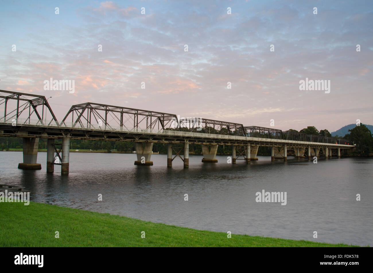 Nowra Bridge stretches over the Shoalhaven River at dawn in New South ...