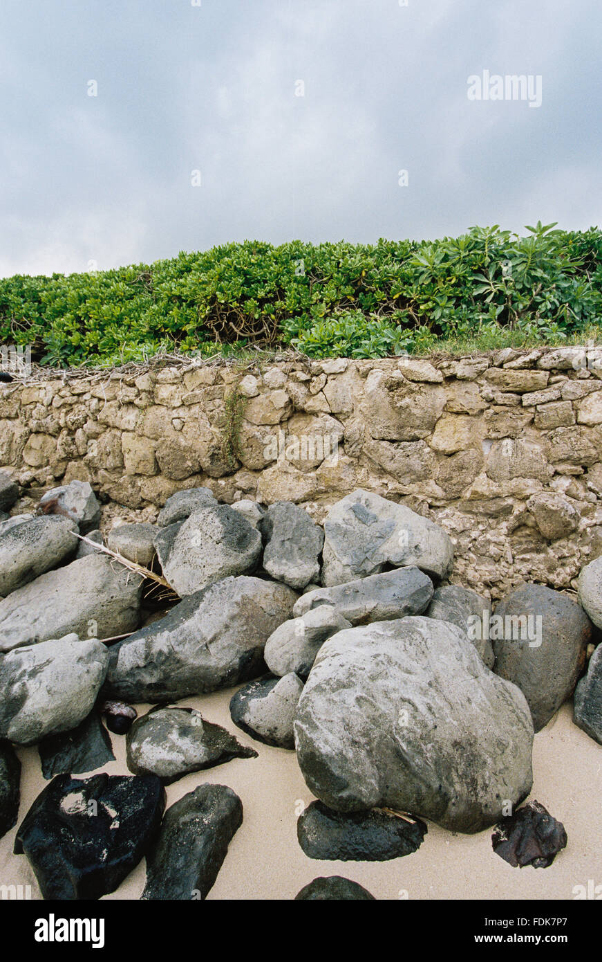 Sea wall and rocks on beach, Oahu, Hawaii, United States Stock Photo ...