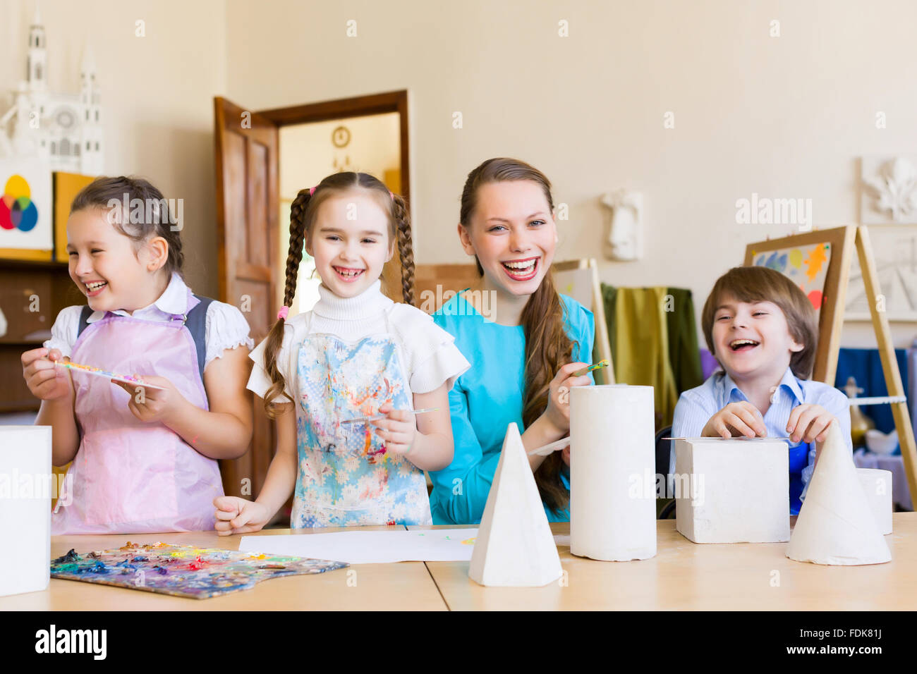 Little children painting and playing at kindergarten Stock Photo - Alamy