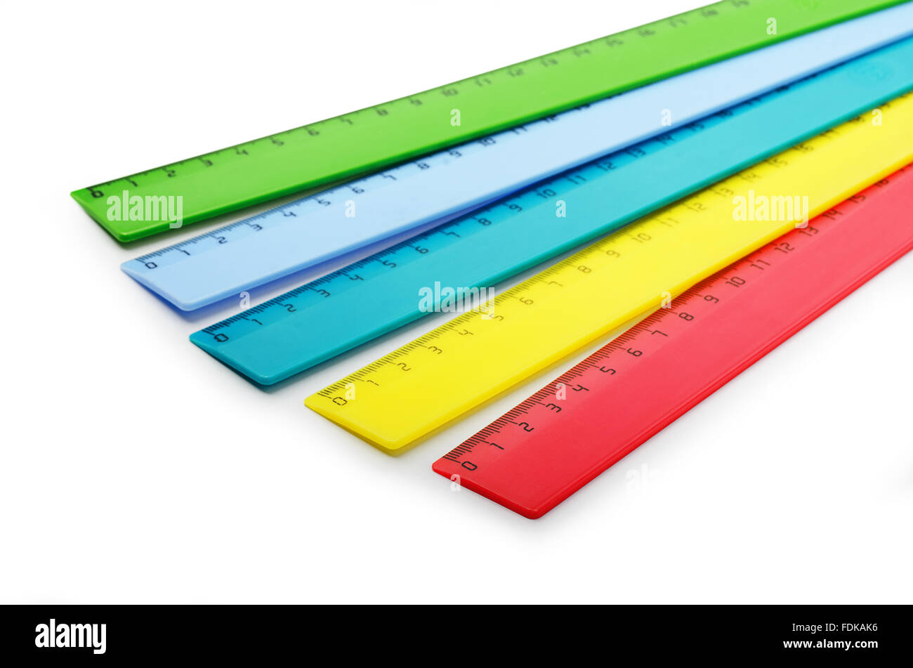 Multicolor plastic rulers on a white background Stock Photo - Alamy
