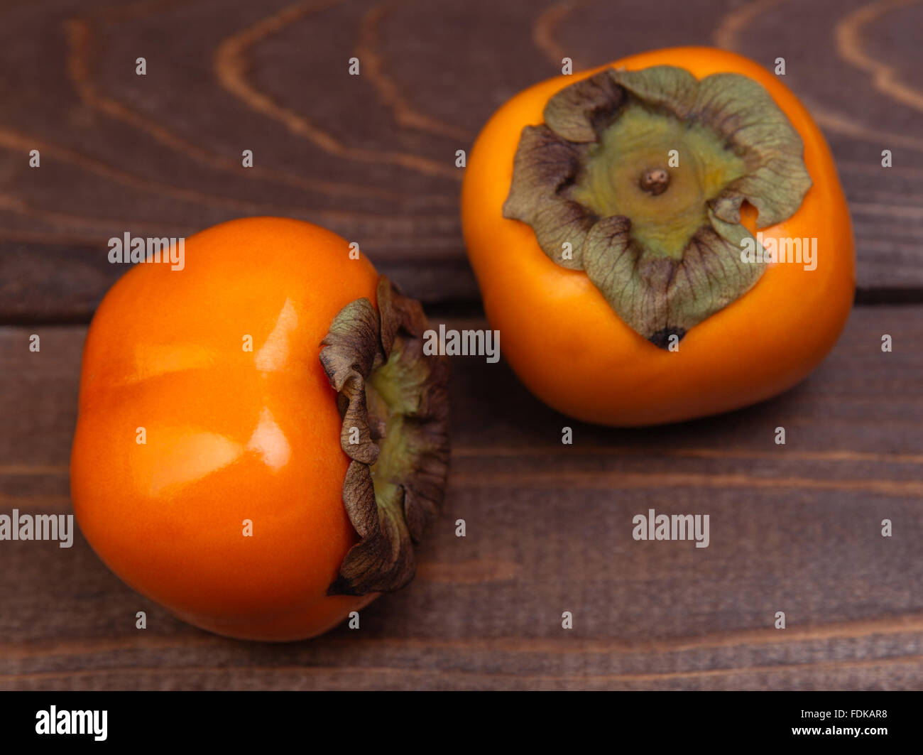 two sweet persimmons Stock Photo - Alamy