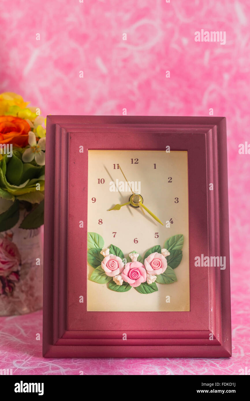 Photo Frame Clock on a pink background Stock Photo - Alamy