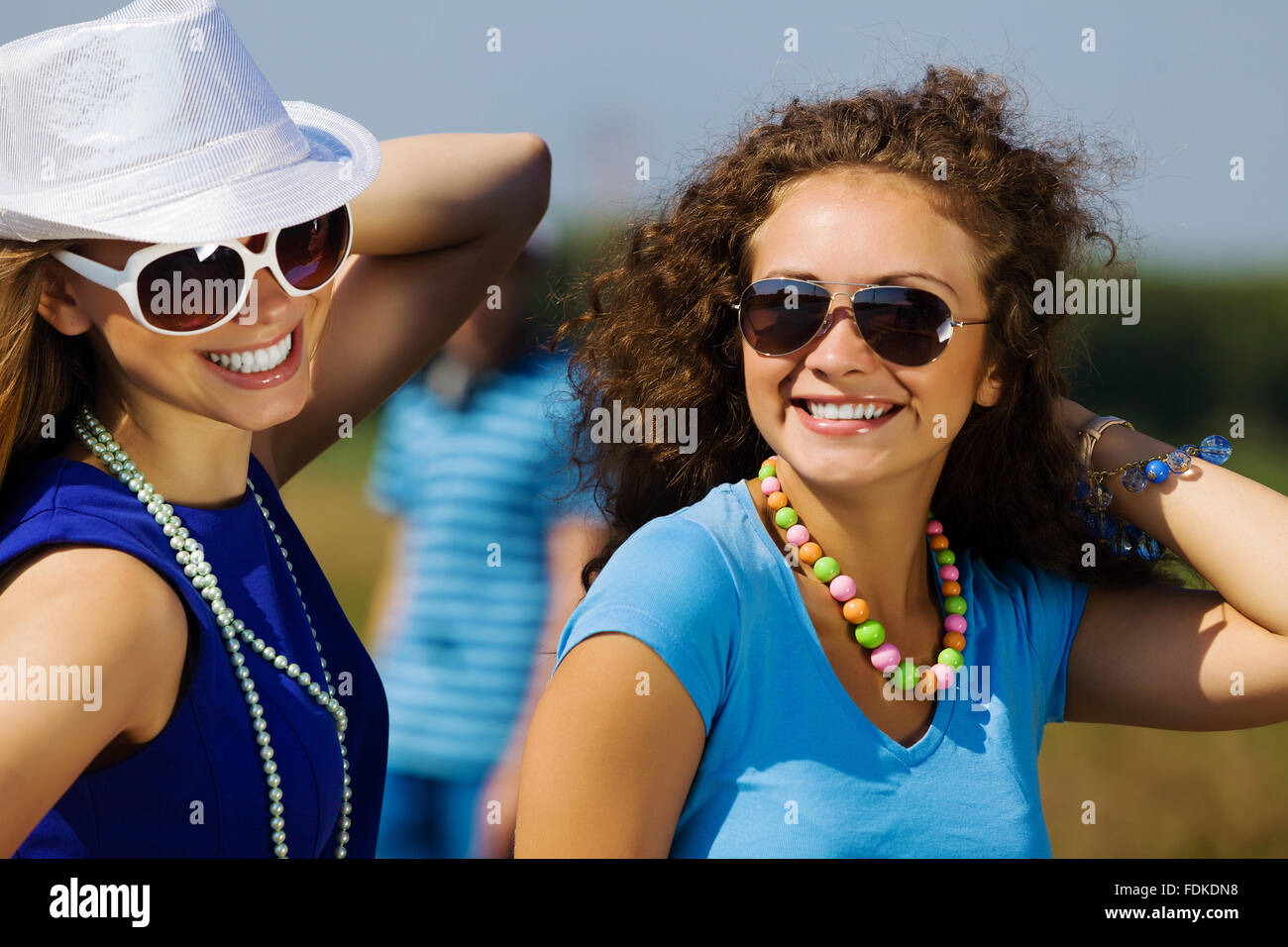 Attractive young women having fun outdoors. Summer vacation Stock Photo ...