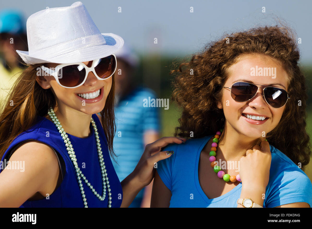 Attractive young women having fun outdoors. Summer vacation Stock Photo ...